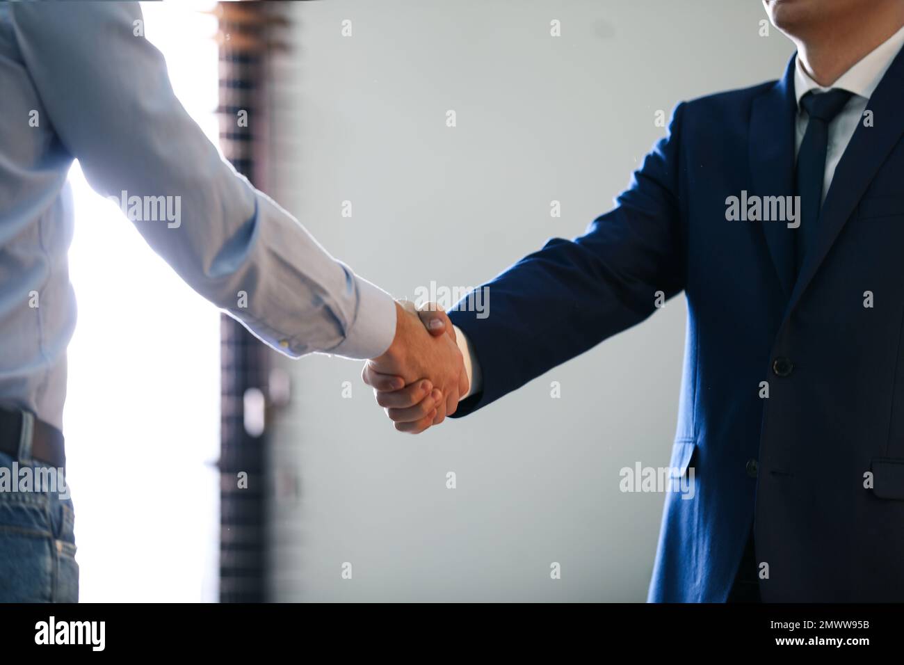 Male lawyer shaking hands with client in office, closeup Stock Photo ...
