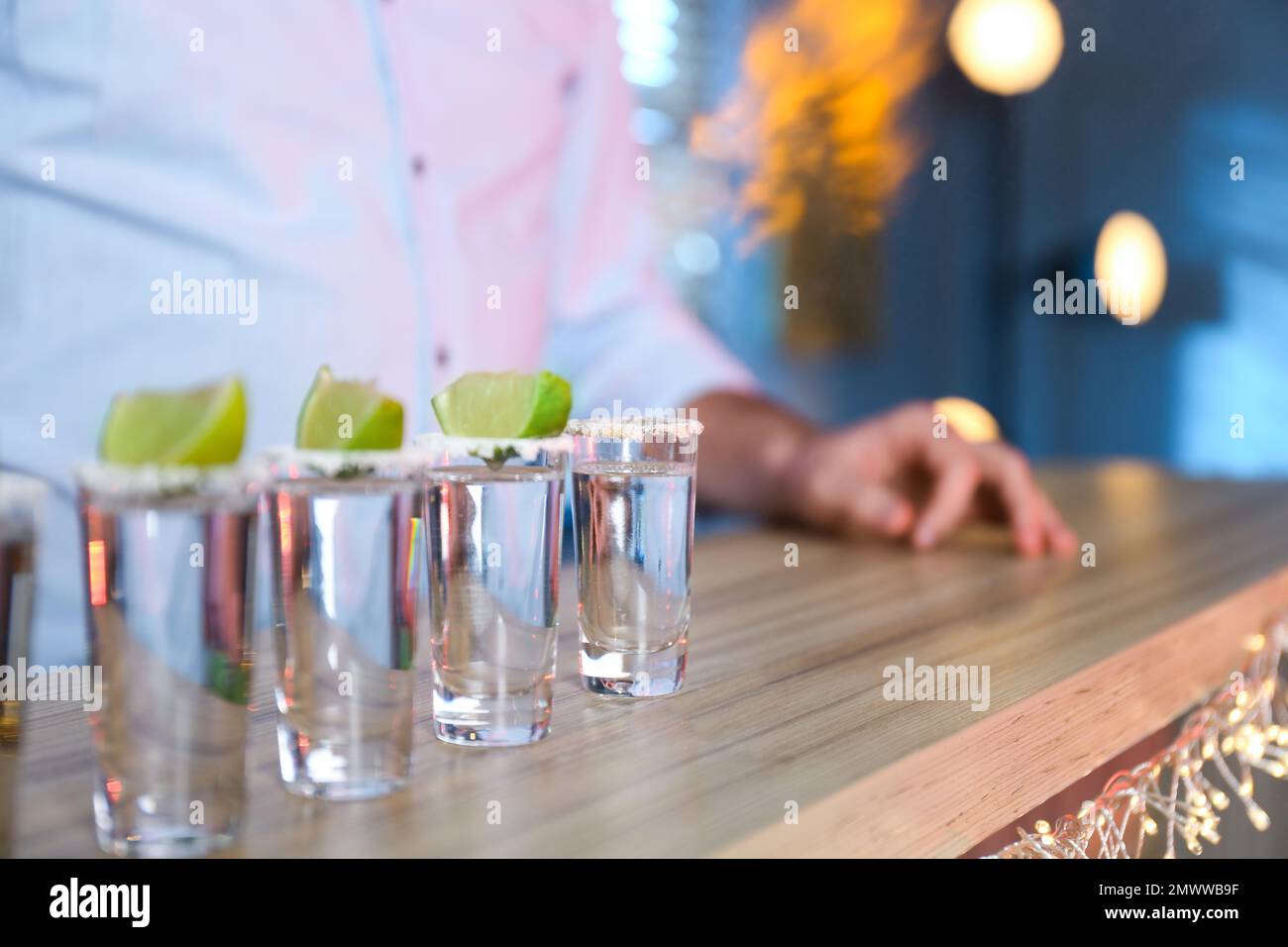 Mexican Tequila shots with salt and lime slices on bar counter Stock ...