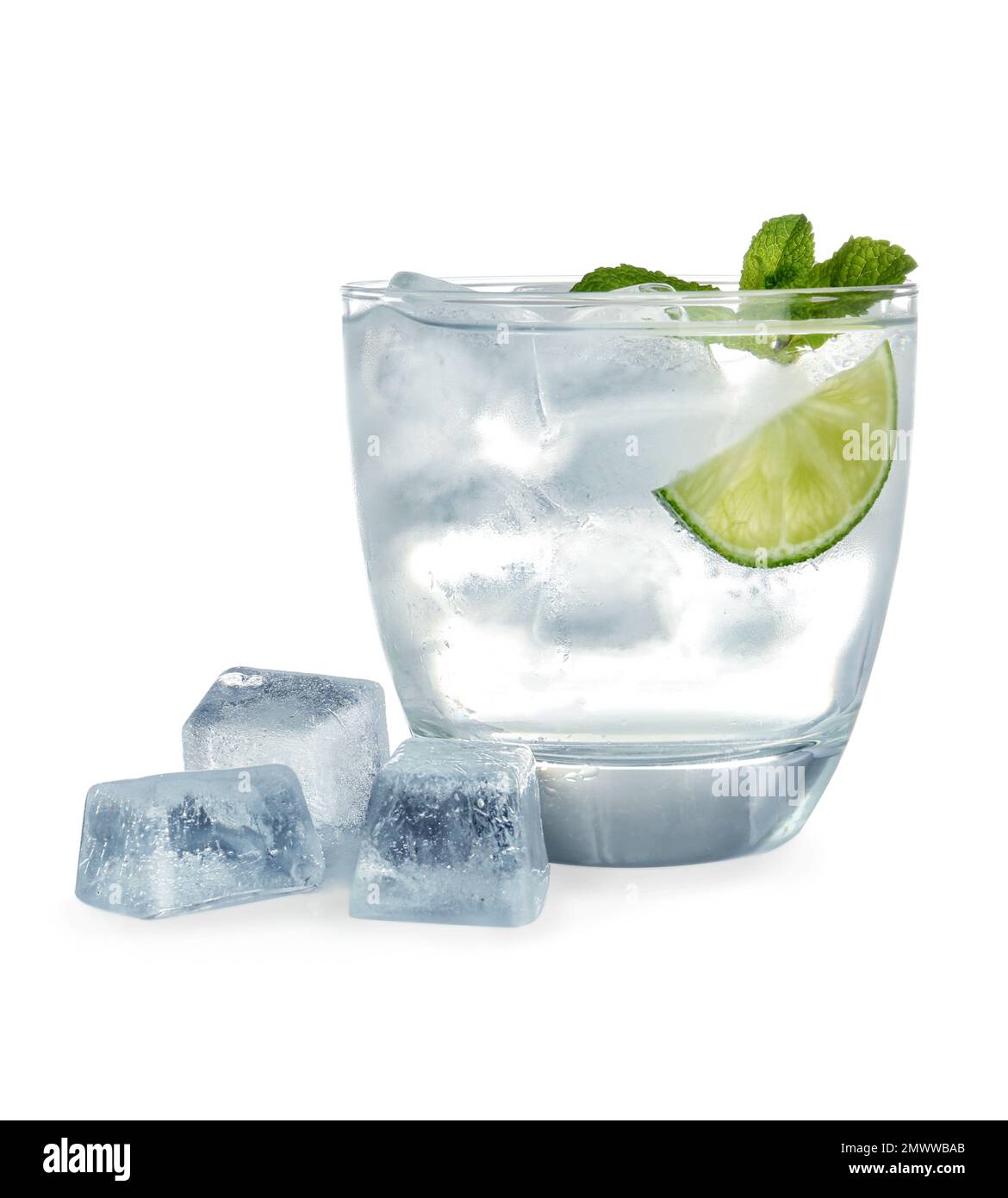 Glass of refreshing drink with ice cubes on white background Stock ...