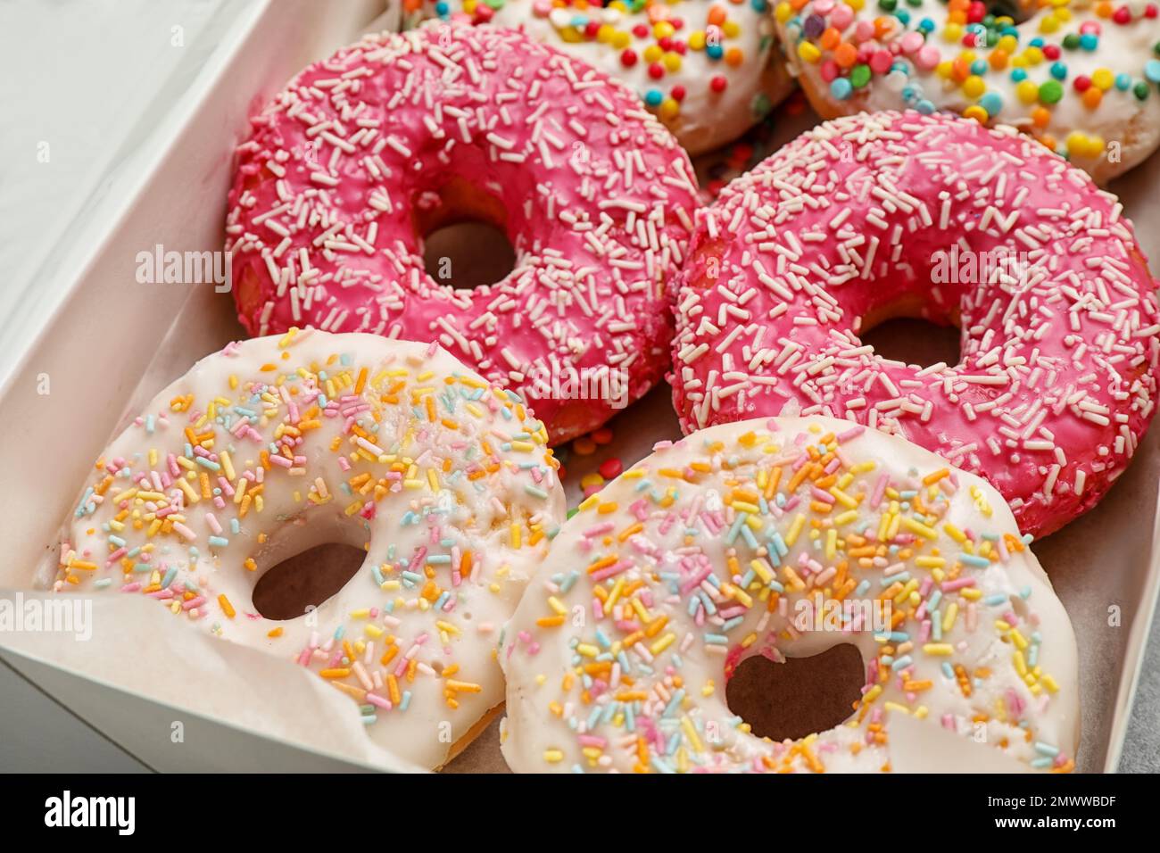 Sweet delicious glazed donuts in box, closeup Stock Photo - Alamy