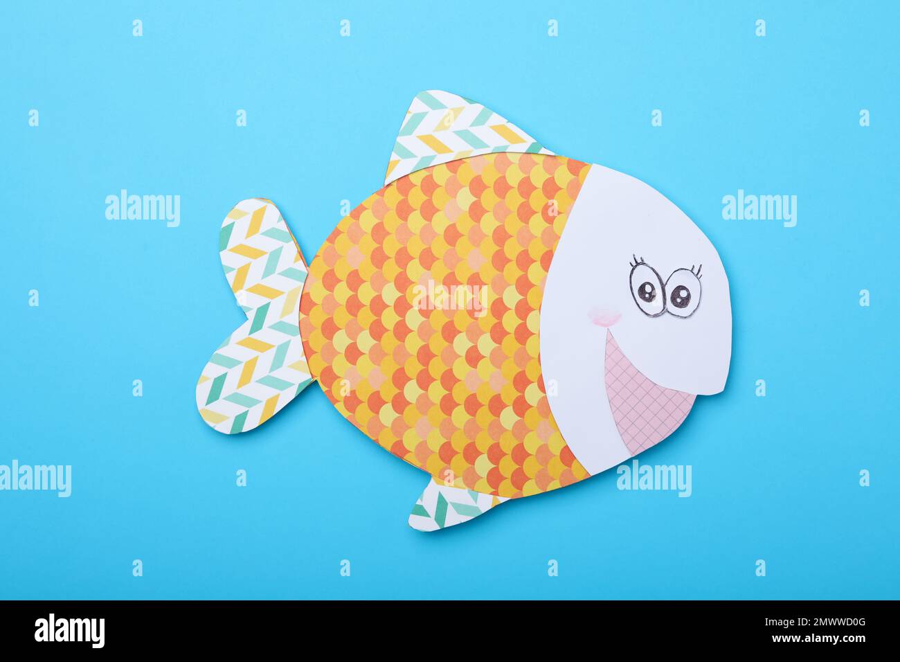 Funny paper fish on light blue background, top view. April Fool's Day ...