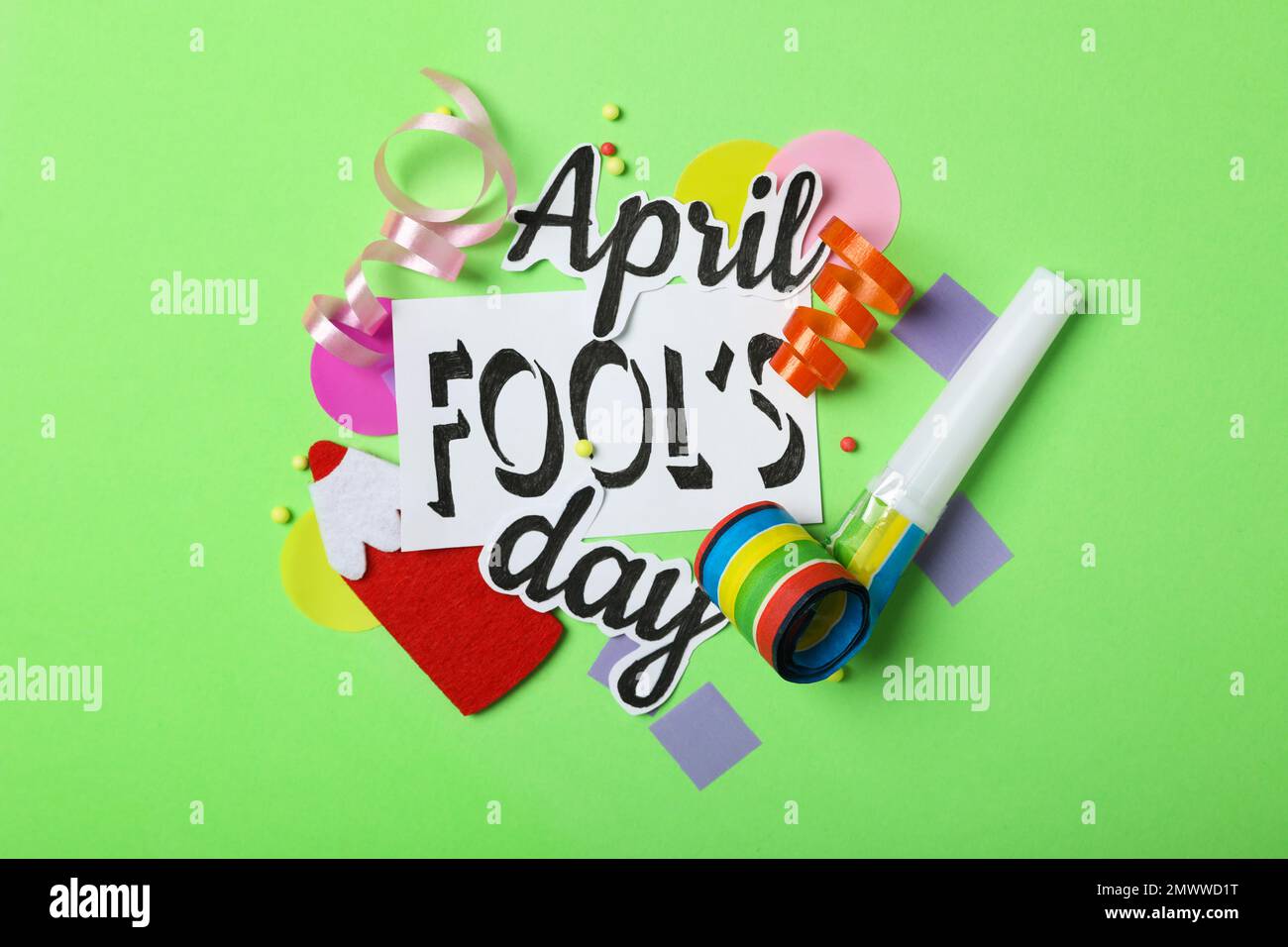 Flat lay composition with words APRIL FOOL'S DAY and party items on ...