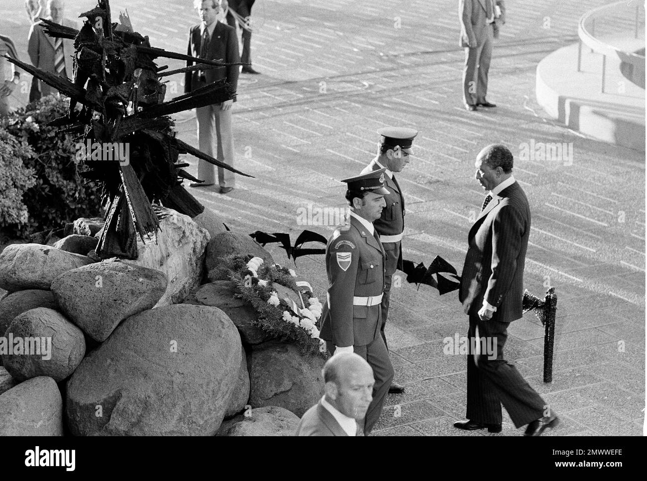 Egyptian President Anwar Sadat stands at the memorial site for dead ...