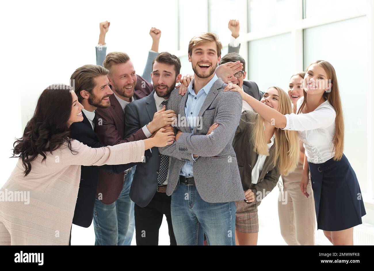 happy business team congratulating their leader . success concept Stock ...