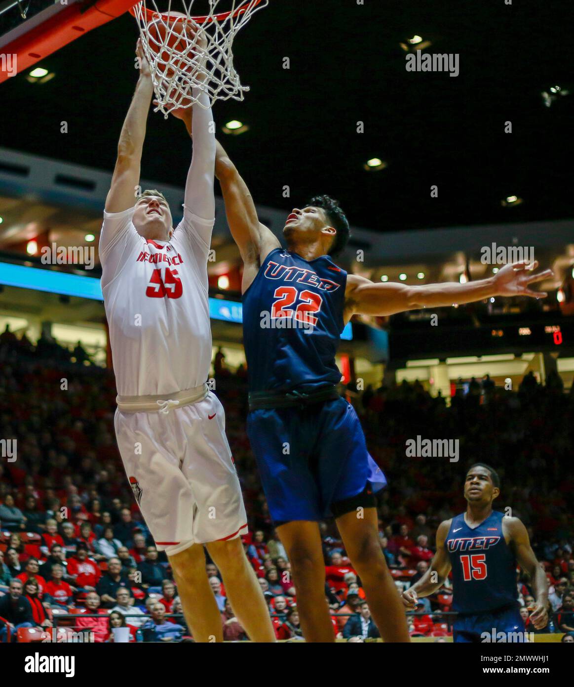 New Mexico's Connor MacDougall (55) puts up a dunk over UTEP's Paul ...
