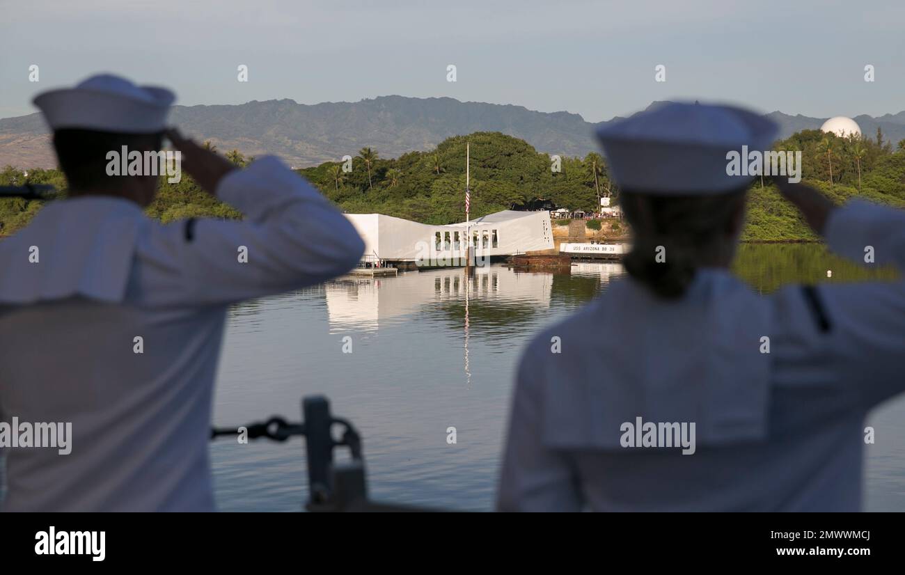 Navy sailors salute the USS Arizona memorial as the USS Halsey sails by ...