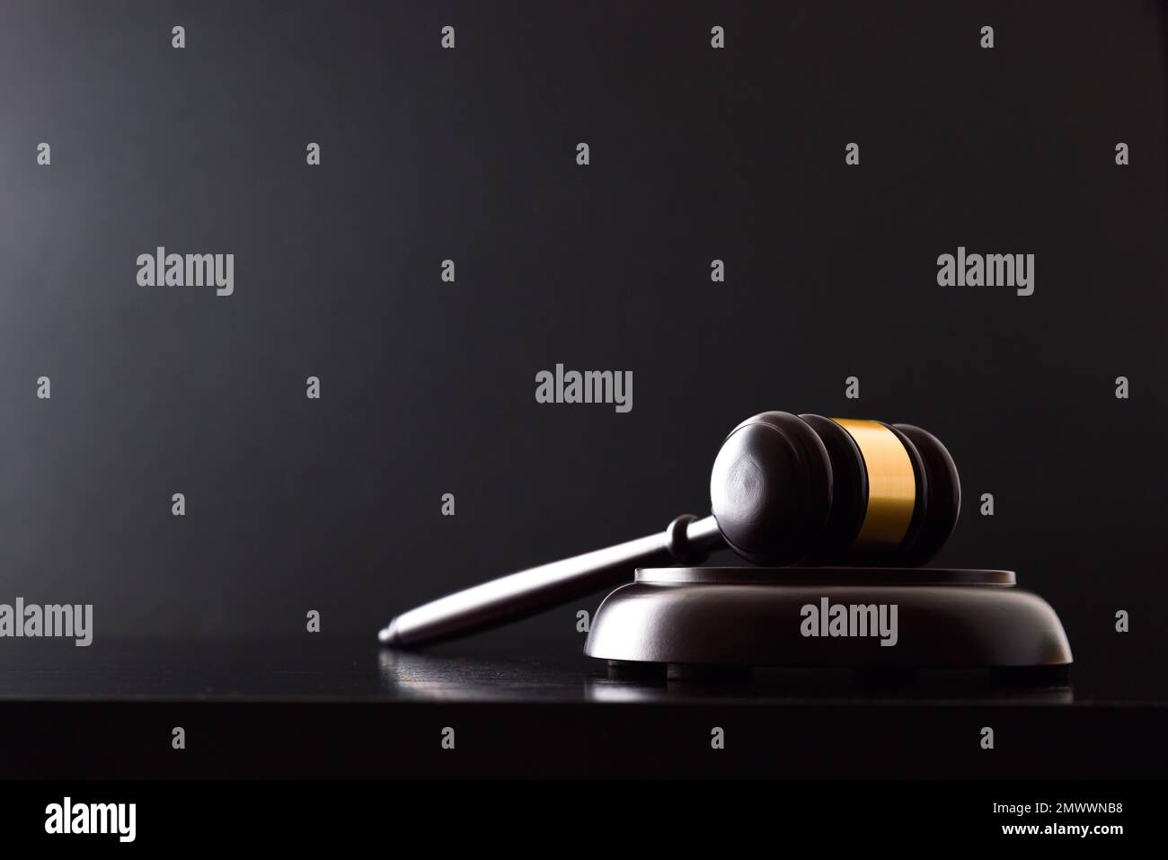 Background of judge's gavel on black table and black isolated ...
