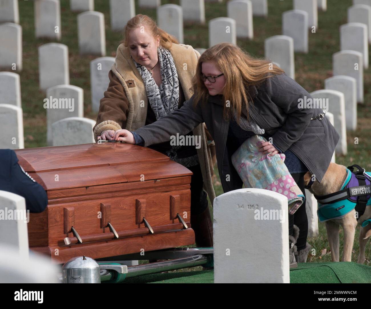 Mourners reach for the casket of former presidential pilot, U.S. Air ...
