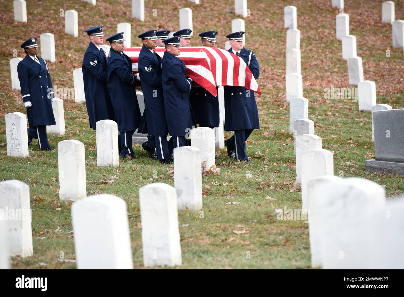 Air Force military member carry the casket of former presidential pilot ...