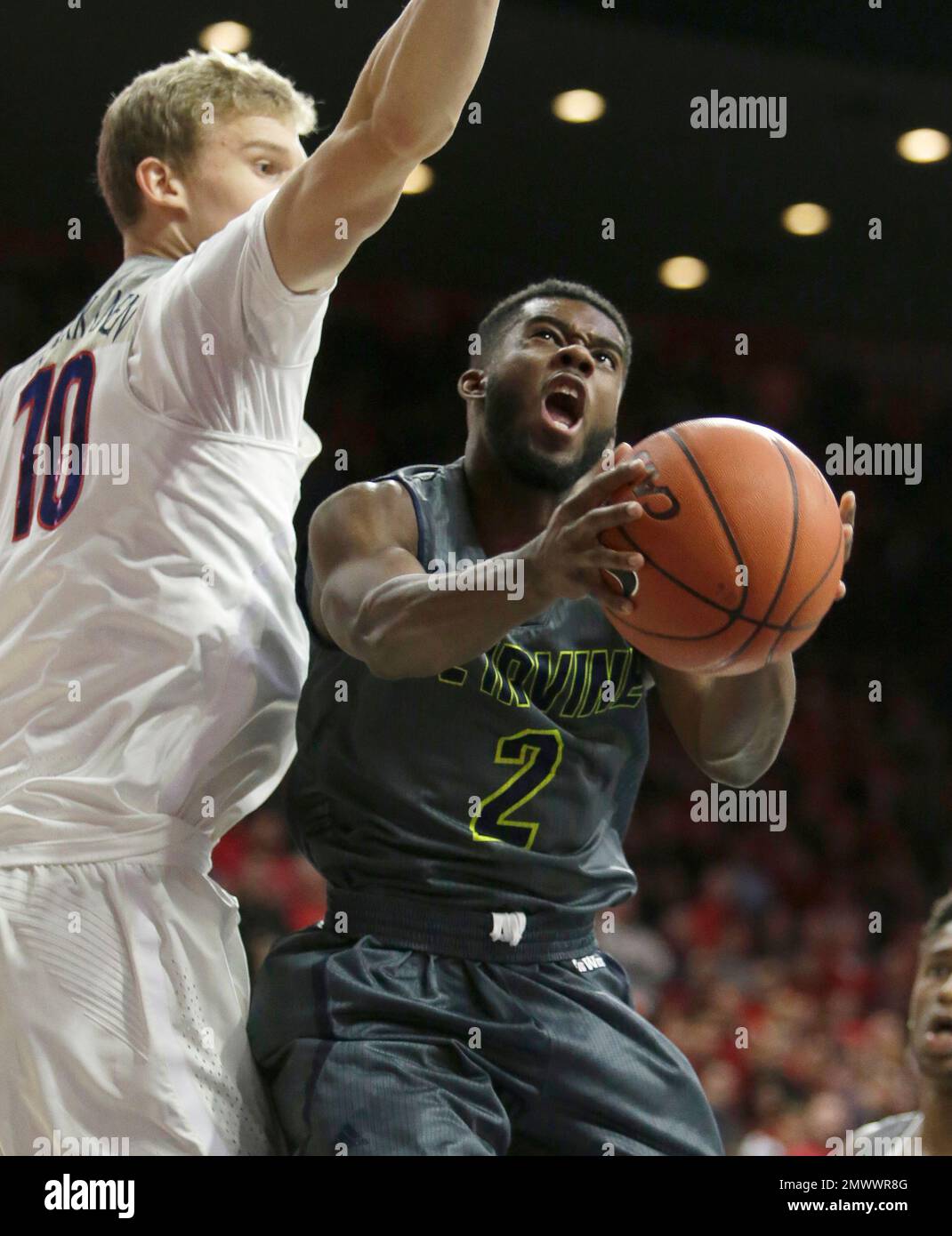 UC Irvine guard Max Hazzard (2) drives on Arizona forward Lauri ...