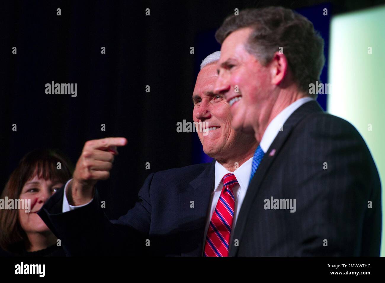 Vice President-elect Mike Pence, center, points to former Sen. Jim ...