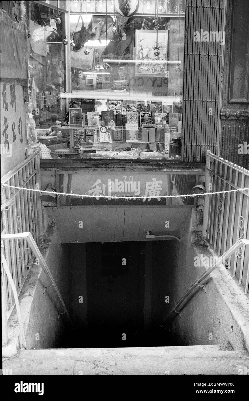 Storefront and basement stairs at 70 Mott Street in New York's ...