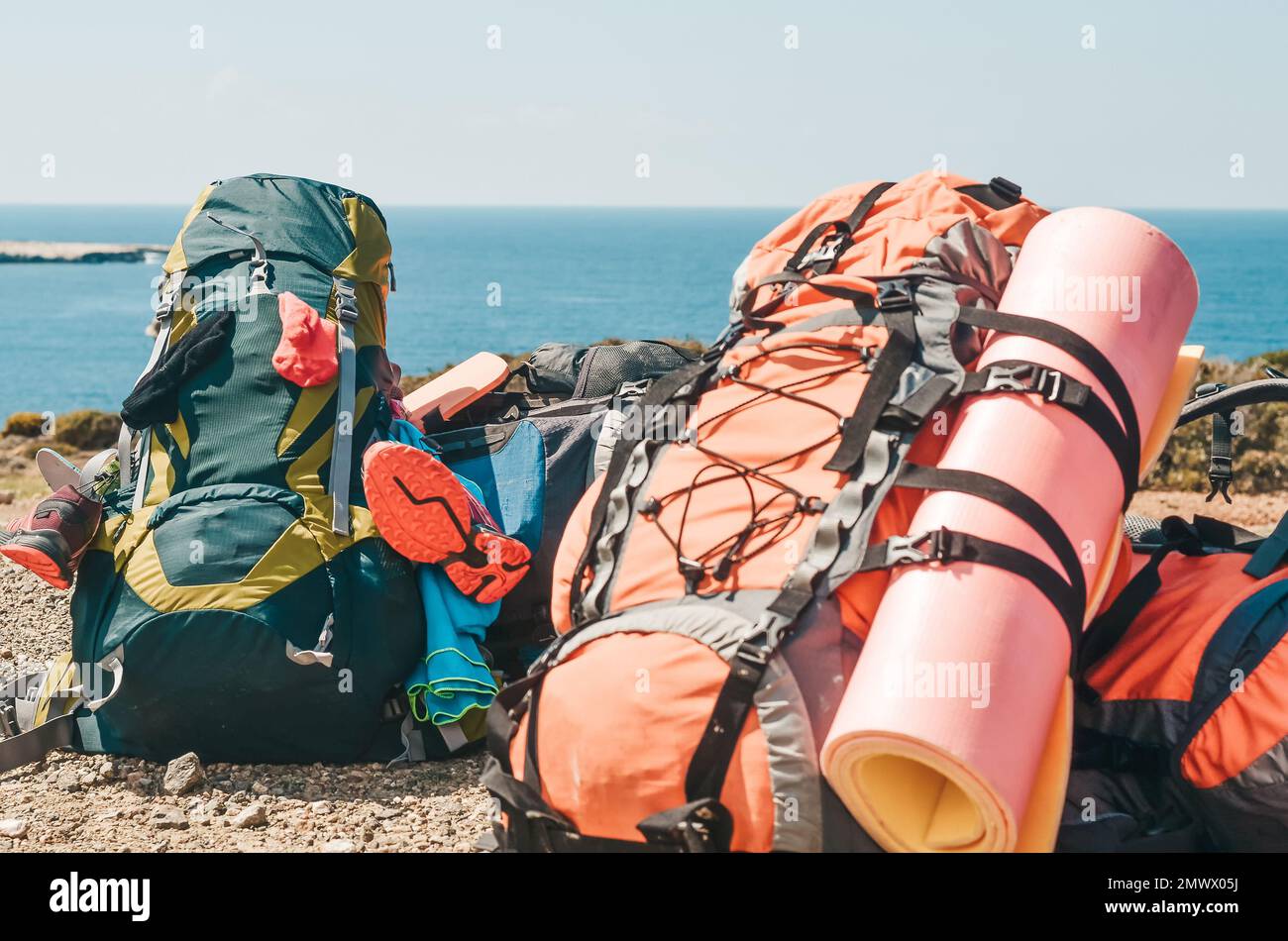 Backpacks for trekking lie down during rest Stock Photo - Alamy