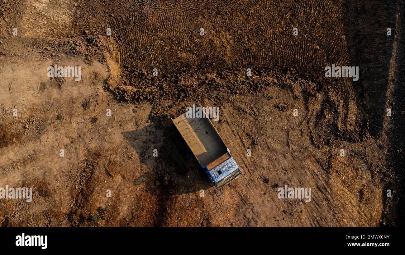 Aerial view of heavy earthmovers in construction site Stock Photo - Alamy