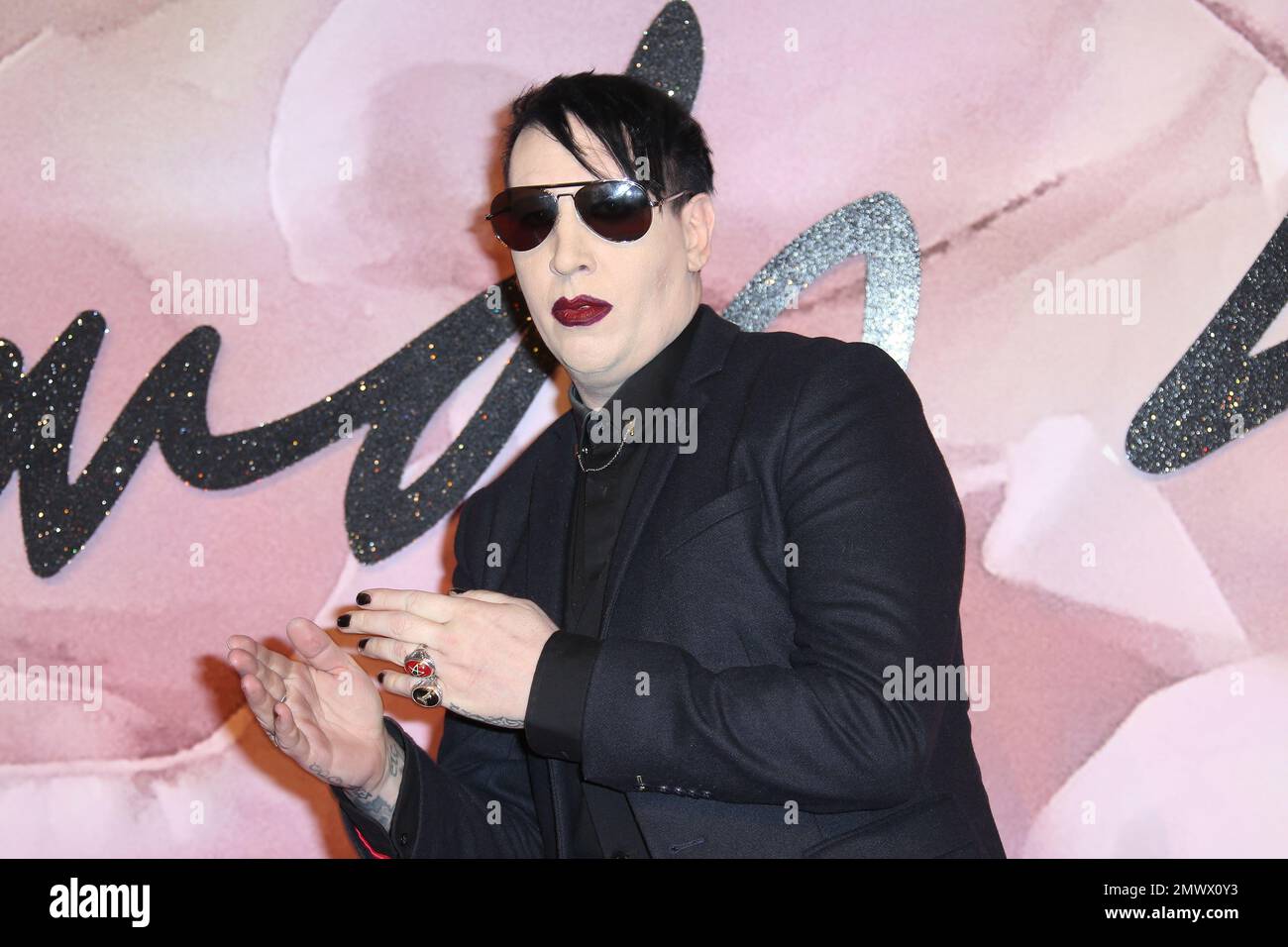 Marilyn Manson poses for photographers at the Fashion Awards in London ...