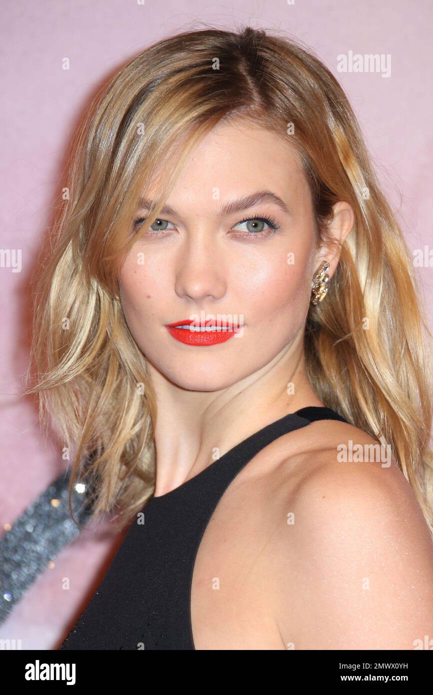 Model Karlie Kloss poses for photographers at the Fashion Awards in ...