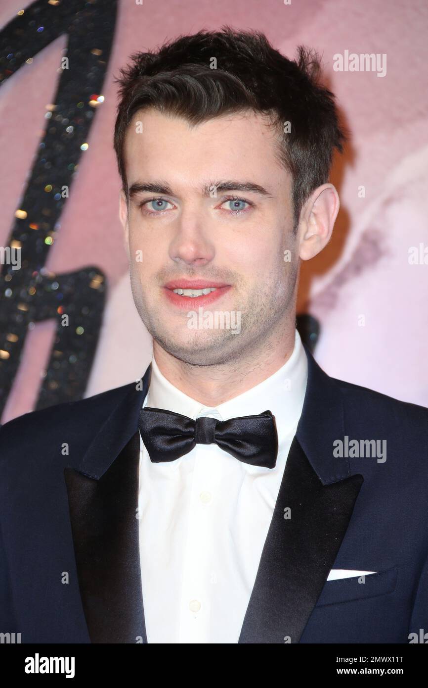 Jack Whitehall poses for photographers at the Fashion Awards in London ...