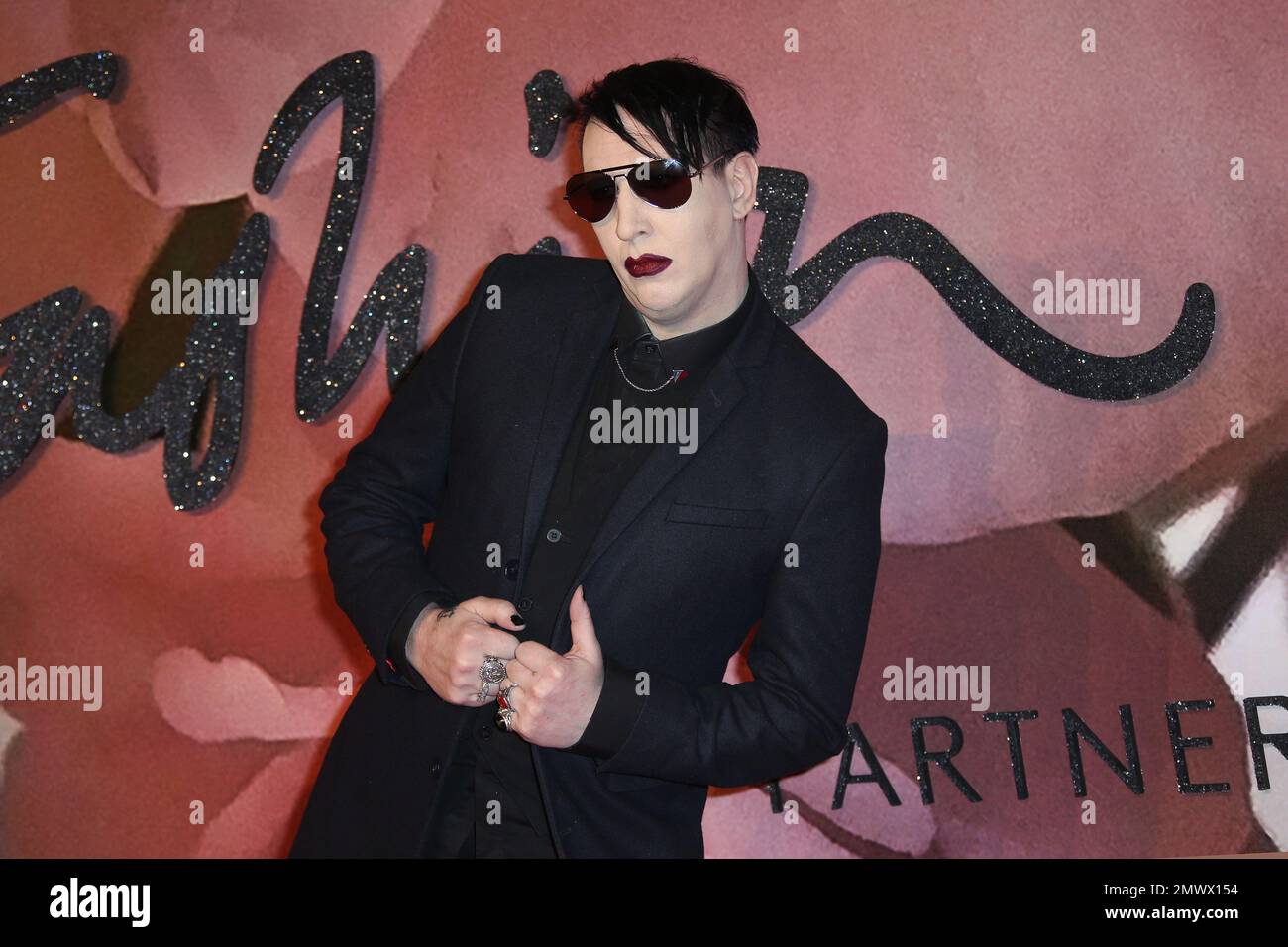 Marilyn Manson poses for photographers at the Fashion Awards in London ...