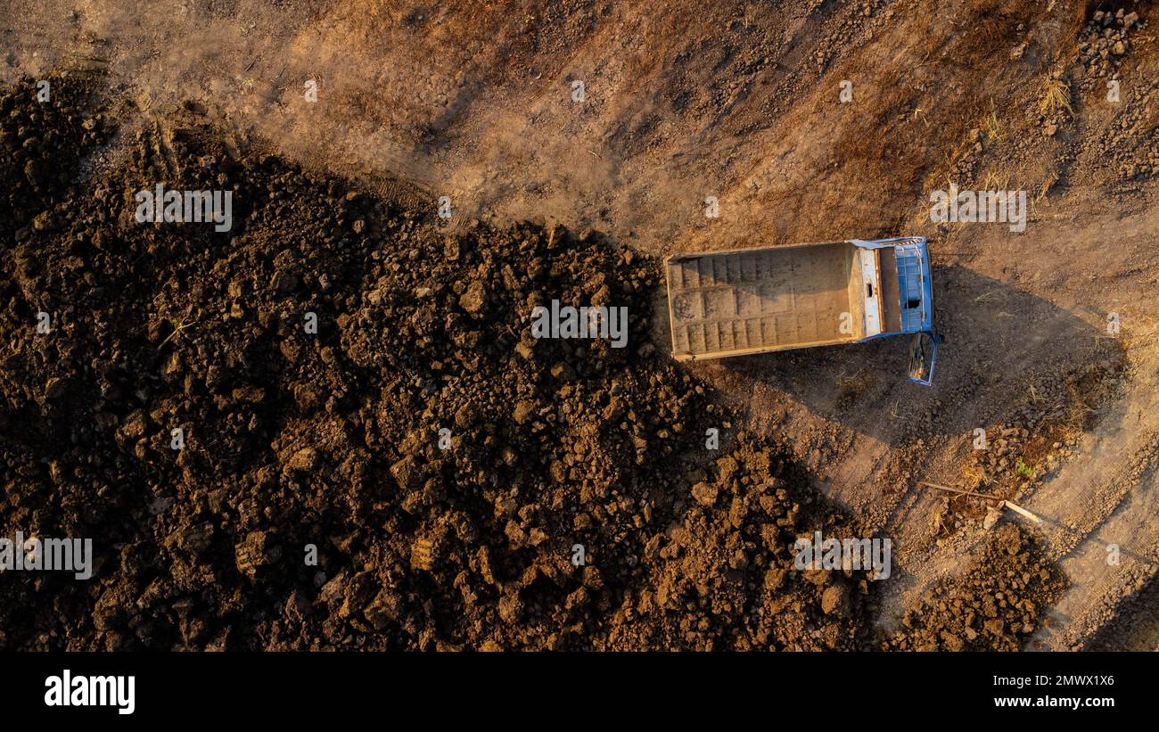 Aerial view of heavy earthmovers in construction site Stock Photo - Alamy