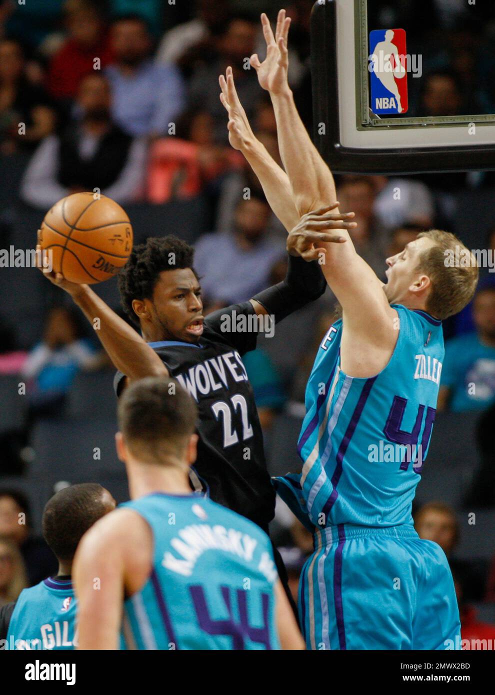 Minnesota Timberwolves forward Andrew Wiggins, left, passes around ...
