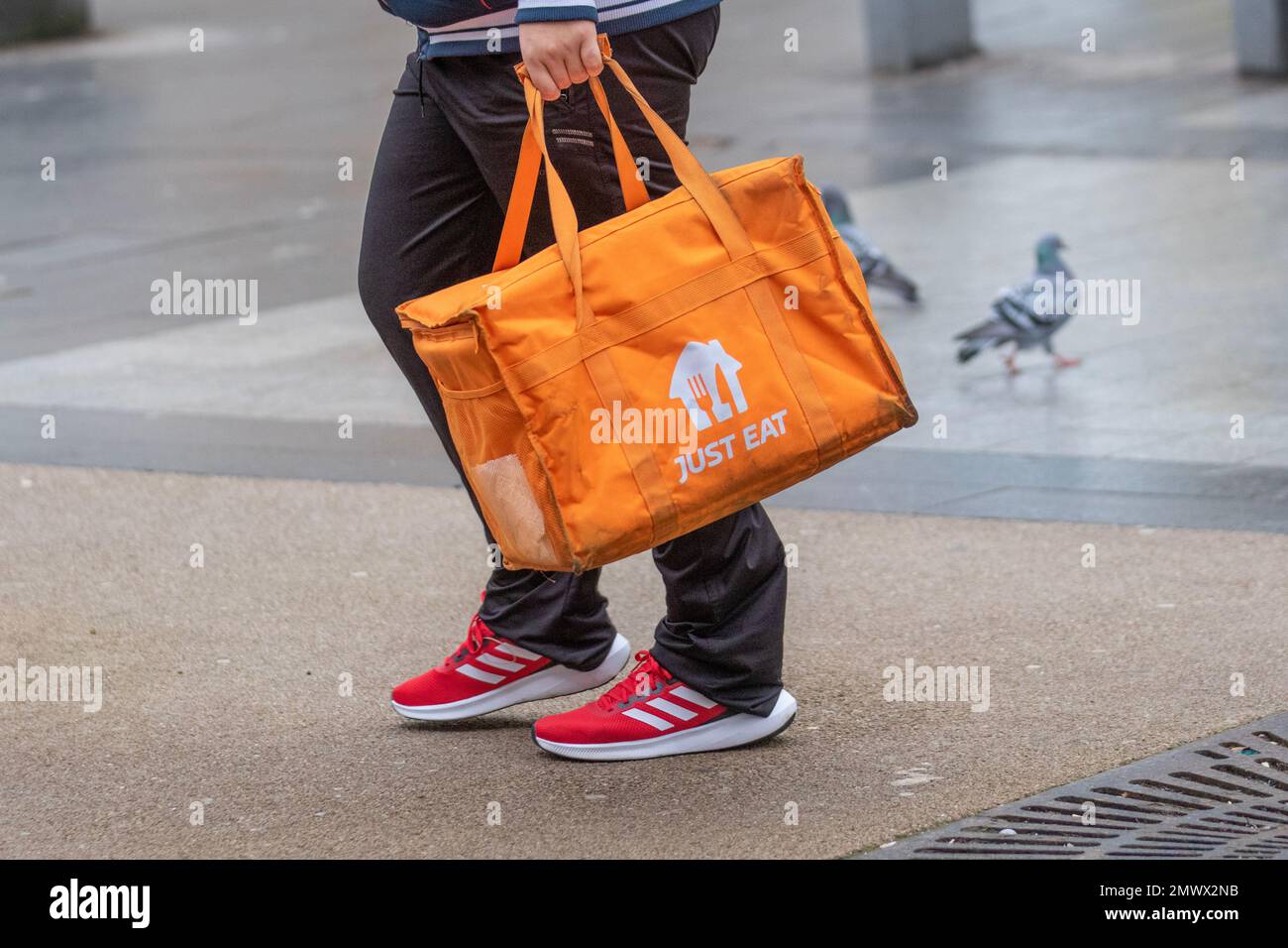 Just Eat orange satchel in Southport. UK High streets food sales ...
