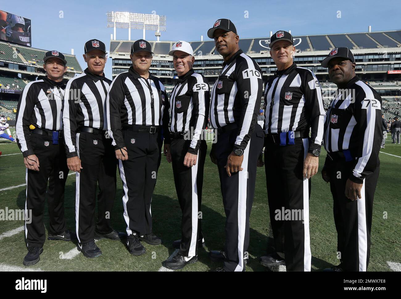 NFL back judge Greg Meyer (78), from left, poses for photos with side ...