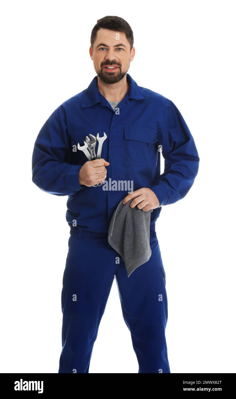 Portrait of professional auto mechanic with wrenches and rag on white ...