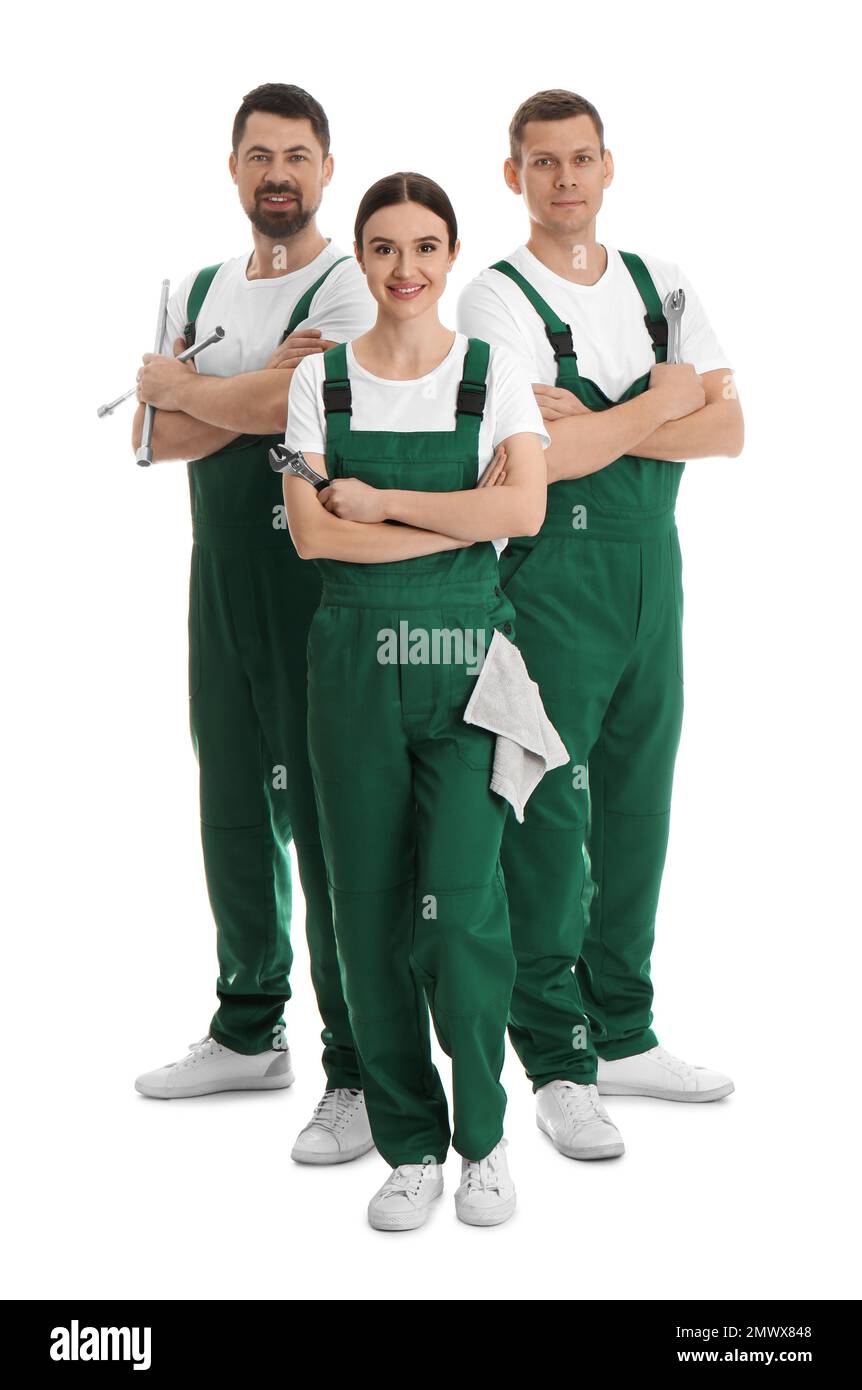 Full length portrait of professional auto mechanics on white background ...