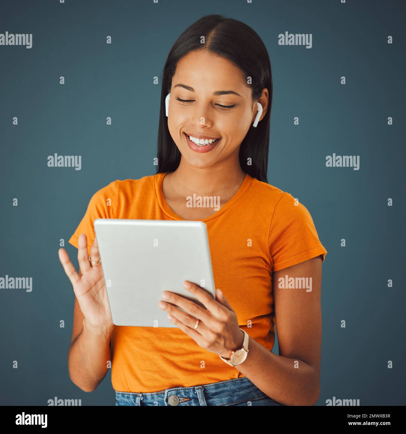 Woman, tablet and listening to music online while streaming and happy ...