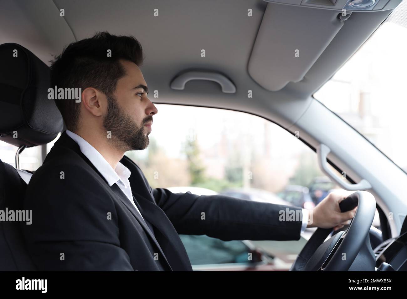 Handsome young man driving hi-res stock photography and images - Alamy