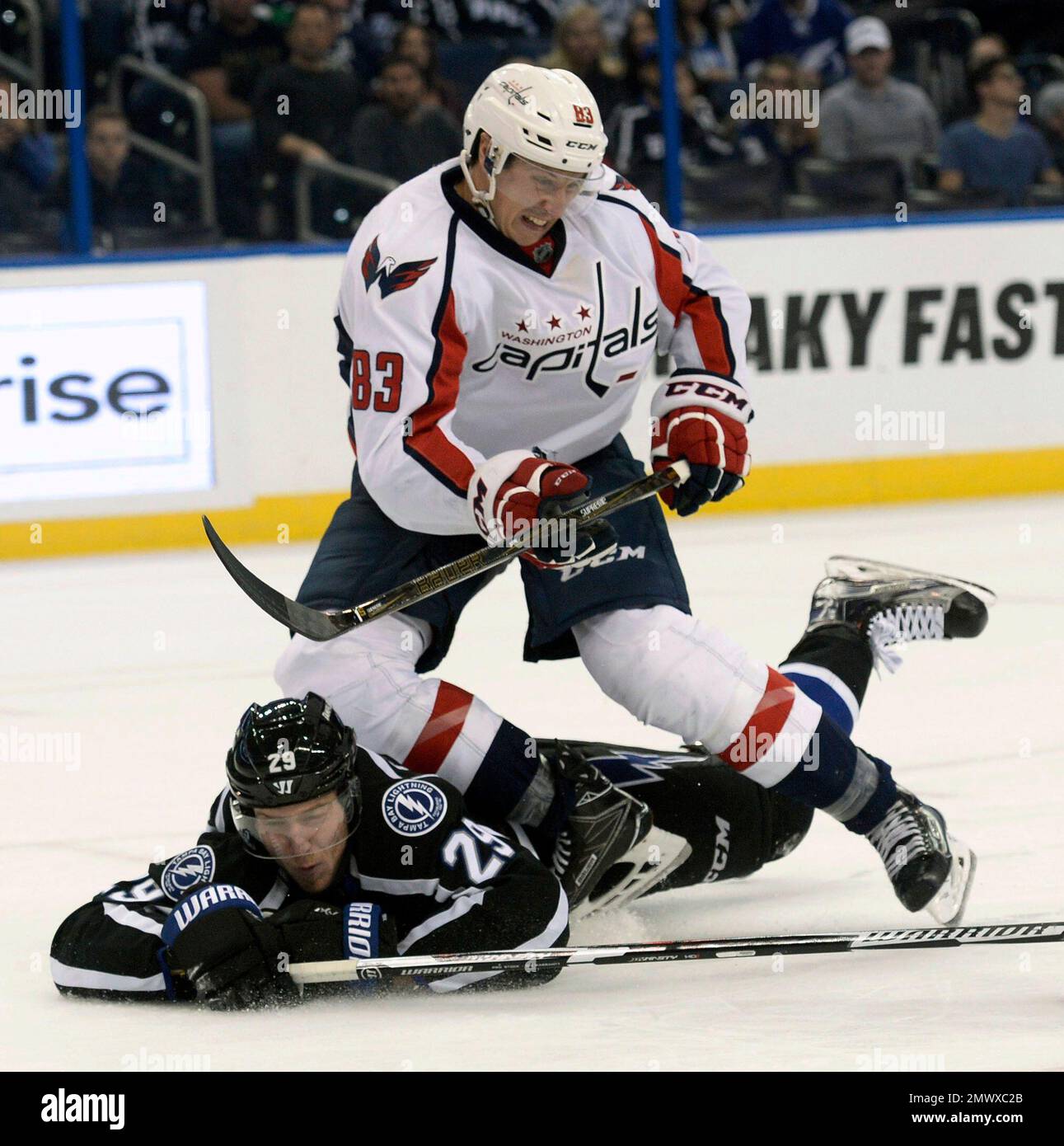 Washington Capitals center Jay Beagle (83) trips over Tampa Bay ...