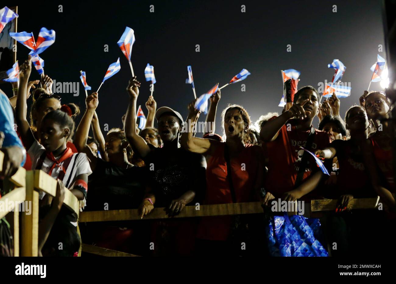 People yell and wave Cuban flags during a rally in honor of late Cuban ...