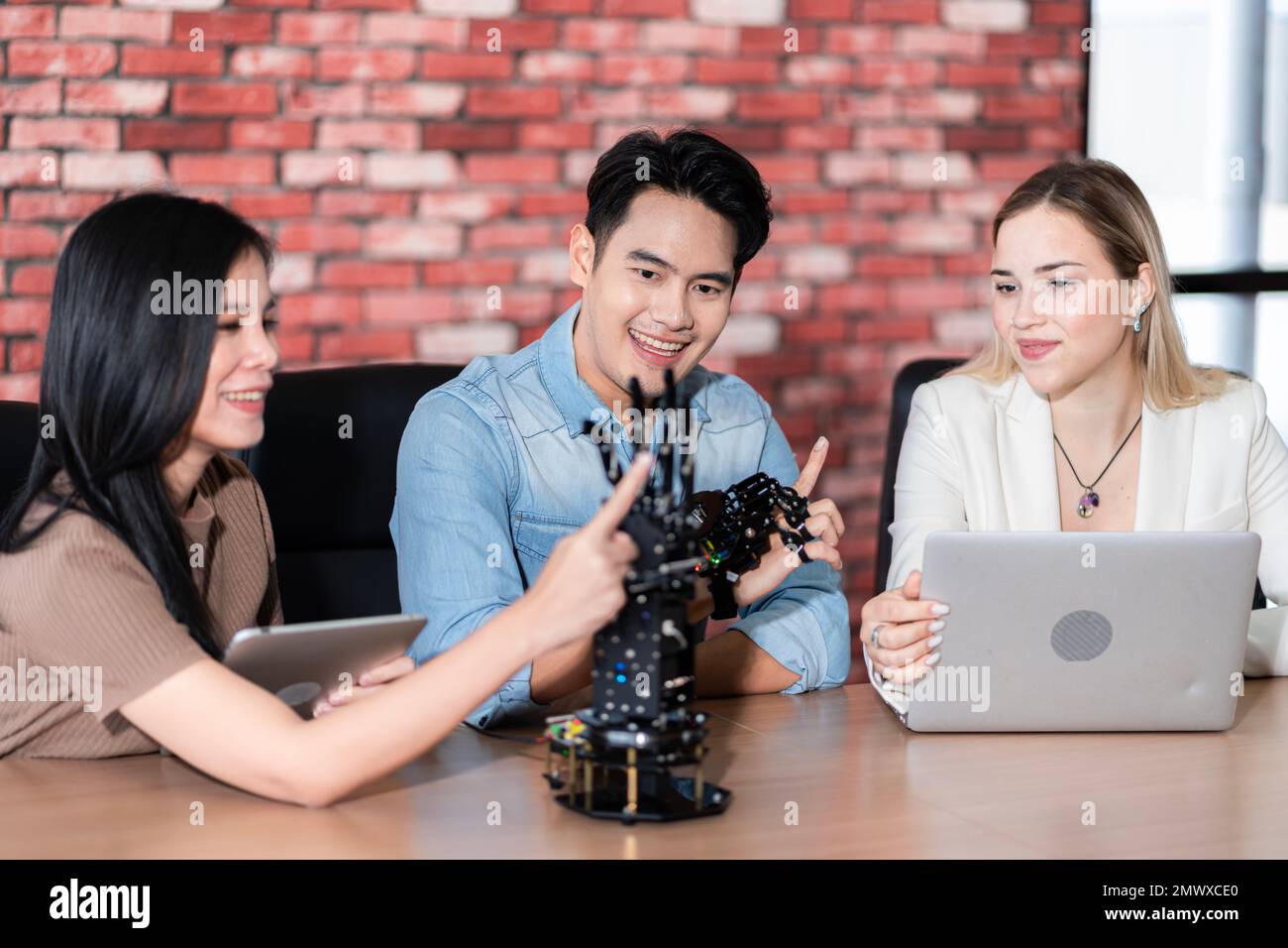 Young students researching inventions with modern technology in ...