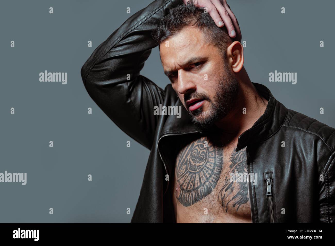 Brutal angry gang man lifestyle, serious handsome guy. Close up ...