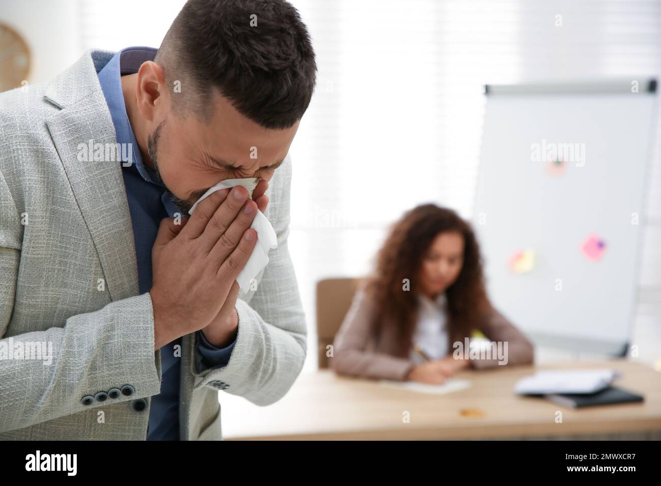 Office worker sneezing hi-res stock photography and images - Alamy