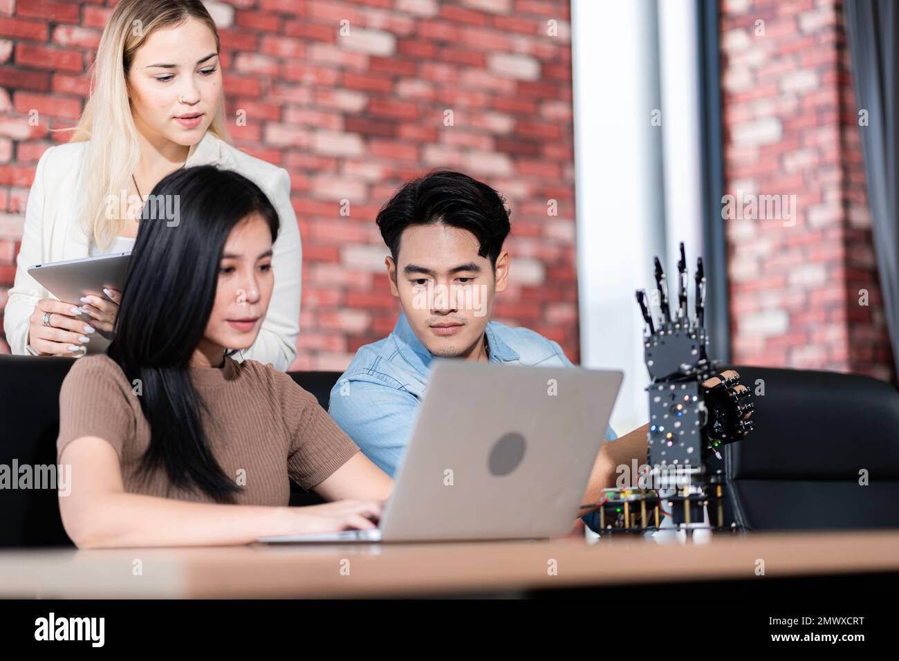 Young students researching inventions with modern technology in ...