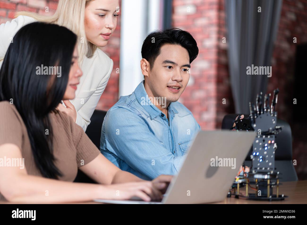 Young students researching inventions with modern technology in ...