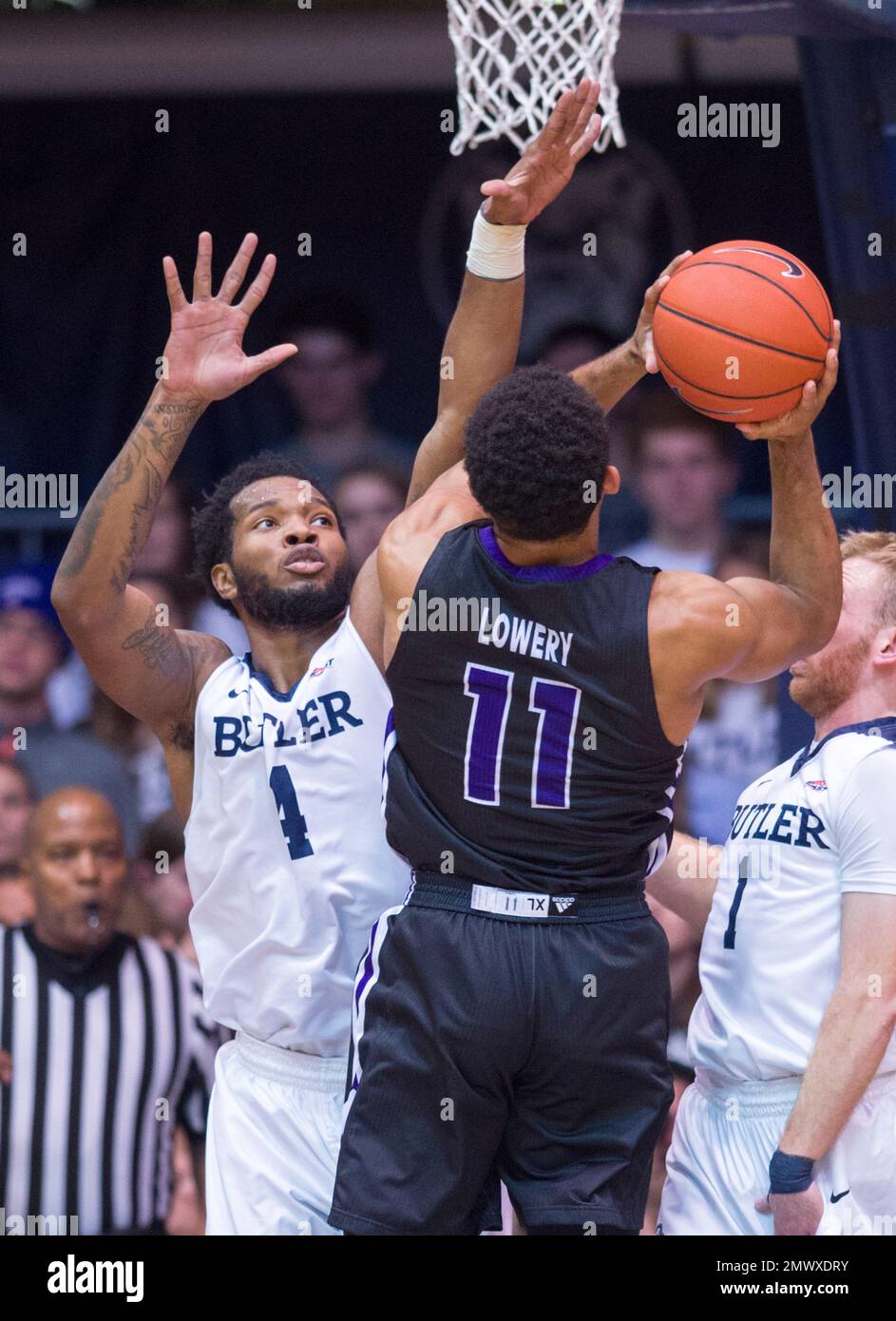 Butler forward Tyler Wideman (4) works to block the shot of Central ...
