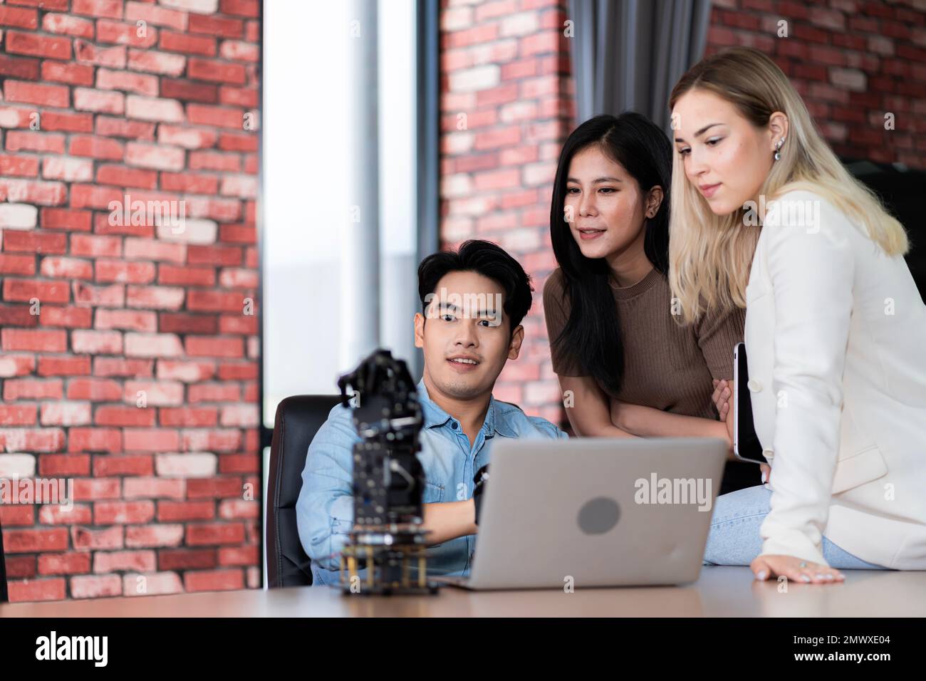 Young students researching inventions with modern technology in ...