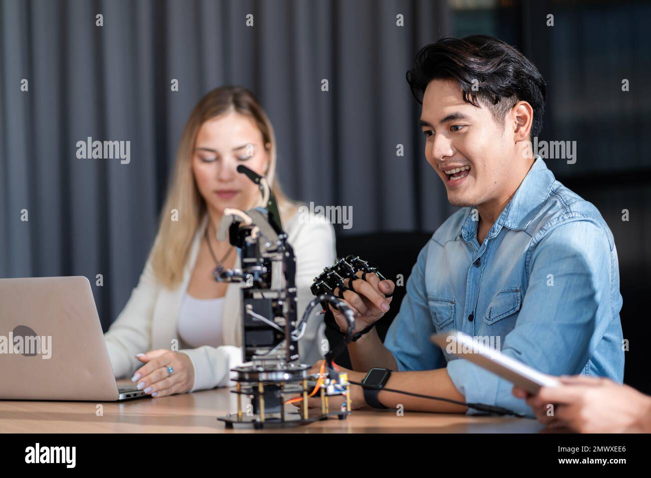 Young students researching inventions with modern technology in ...