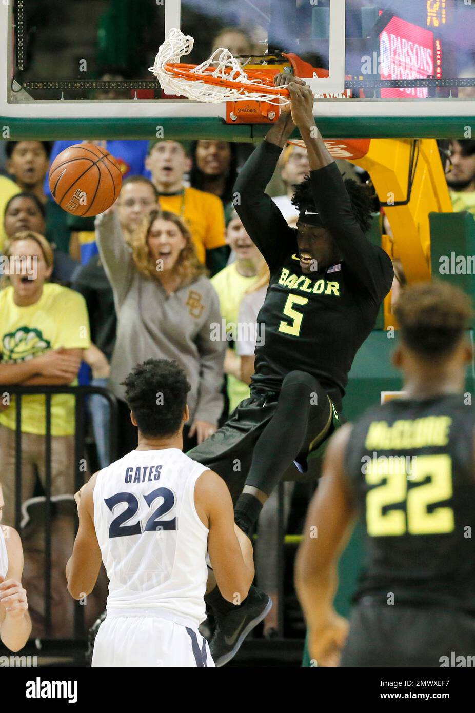 Xavier's Kaiser Gates (22) and Baylor's King McClure (22) watch as ...