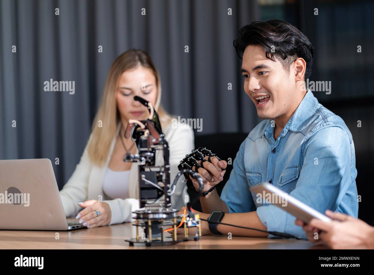 Young students researching inventions with modern technology in ...