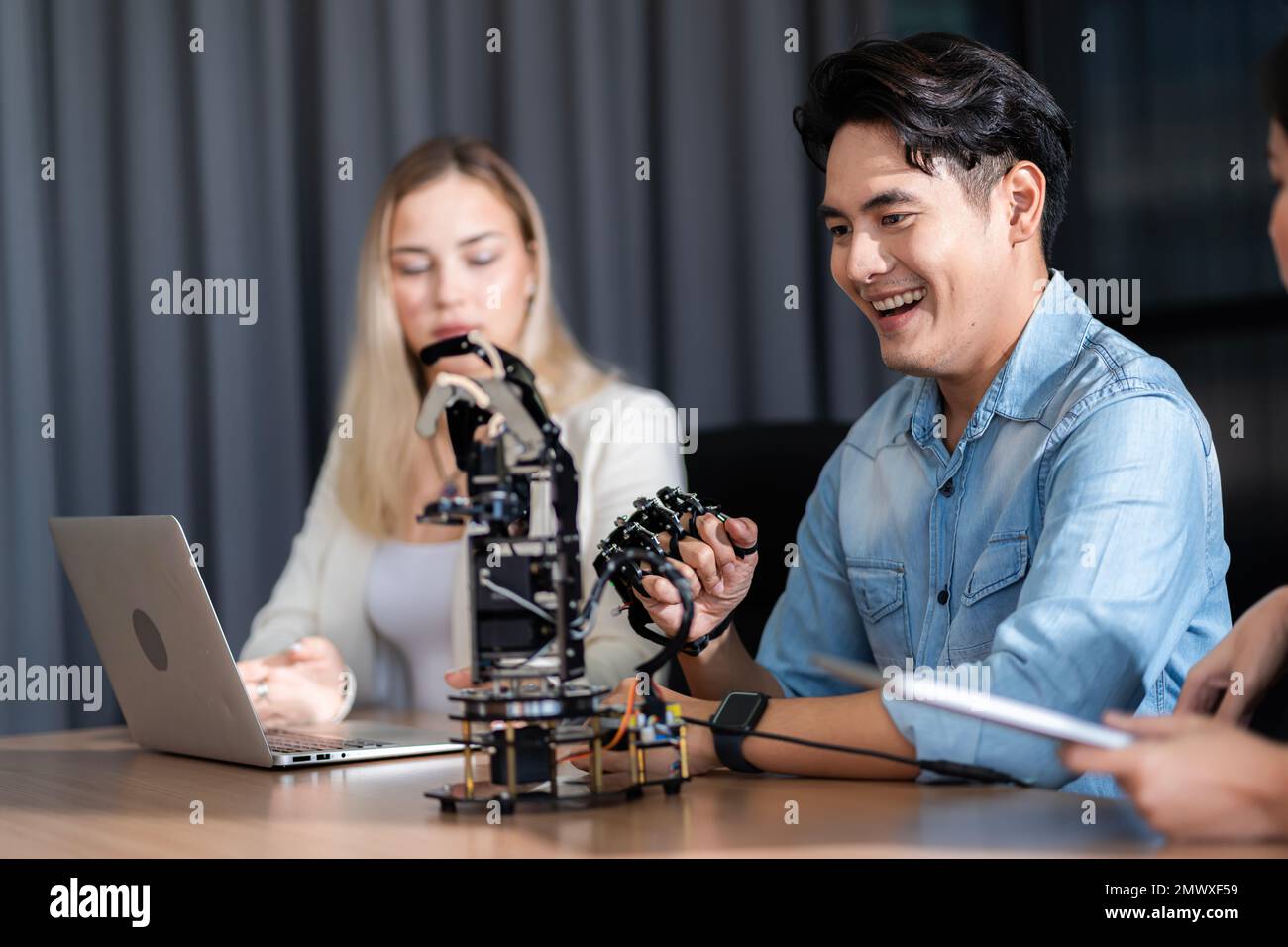 Young students researching inventions with modern technology in ...