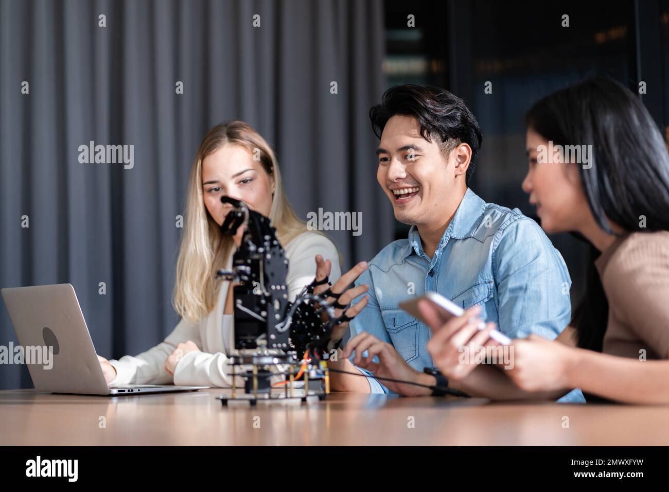 Young students researching inventions with modern technology in ...