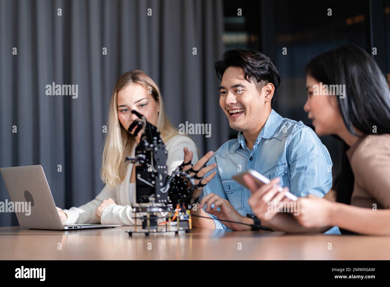 Young students researching inventions with modern technology in ...