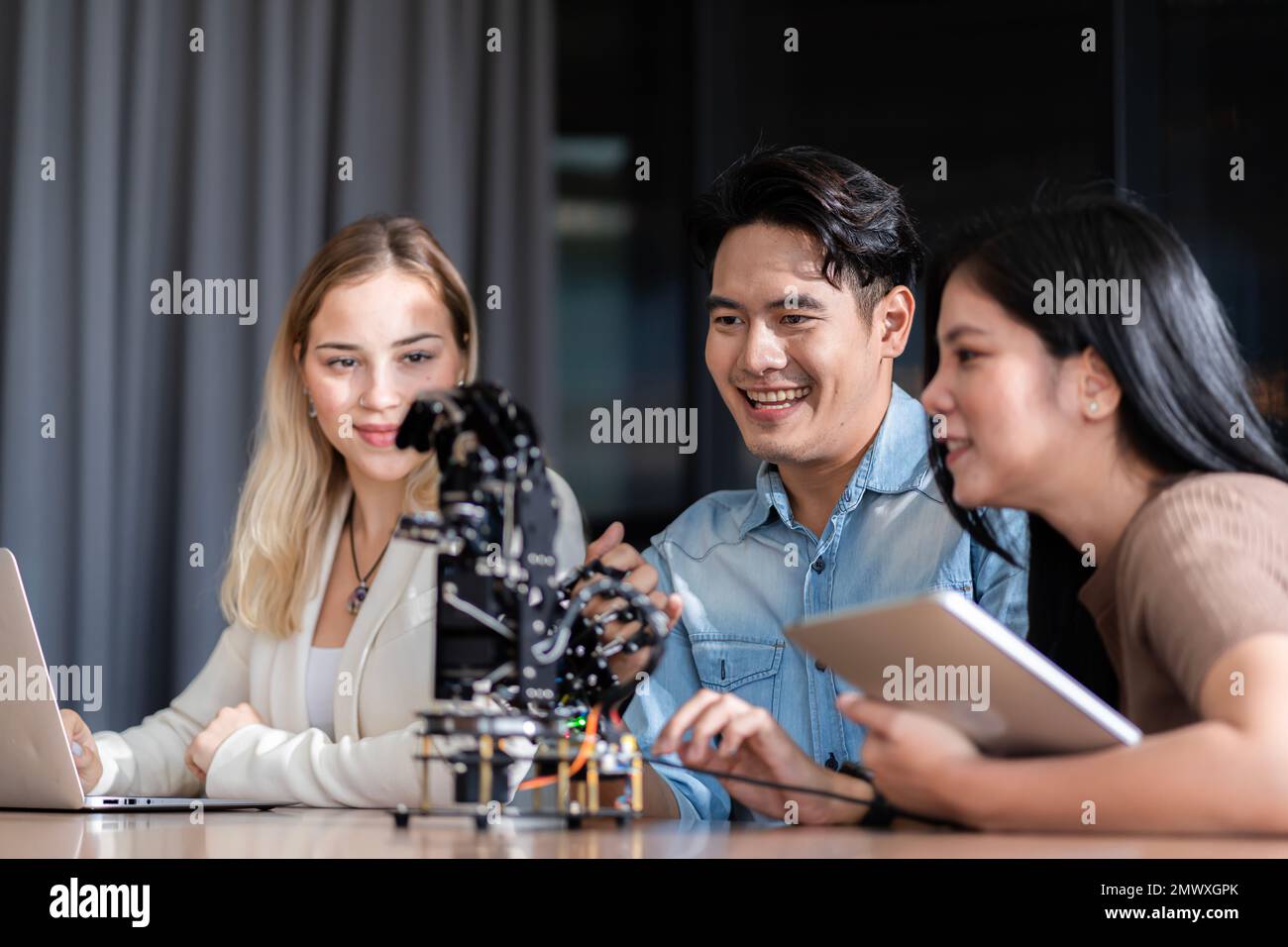 Young students researching inventions with modern technology in ...