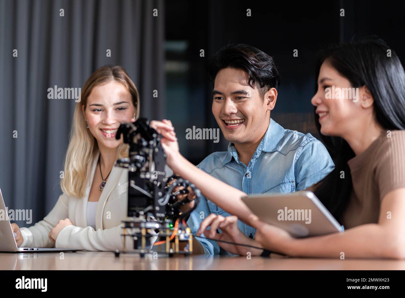 Young students researching inventions with modern technology in ...