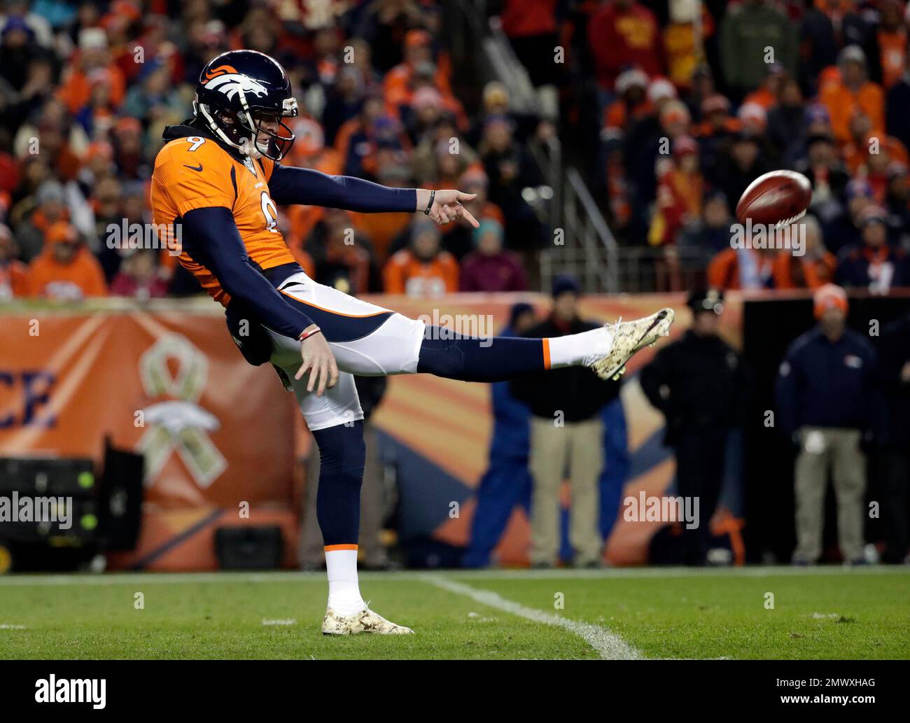 Denver Broncos punter Riley Dixon punts against the Kansas City Chiefs ...
