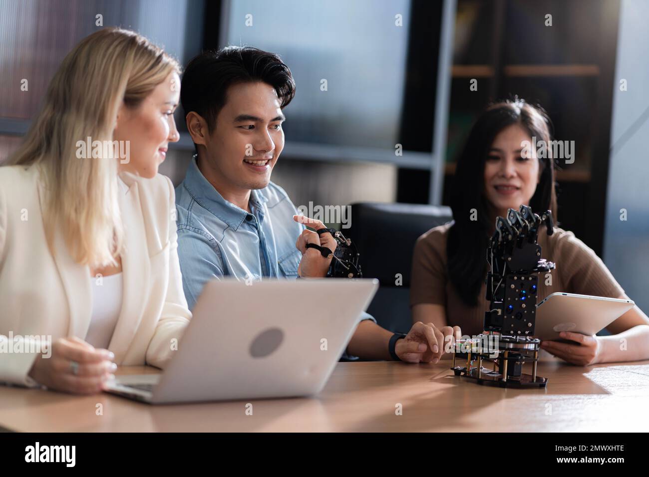 Young students researching inventions with modern technology in ...