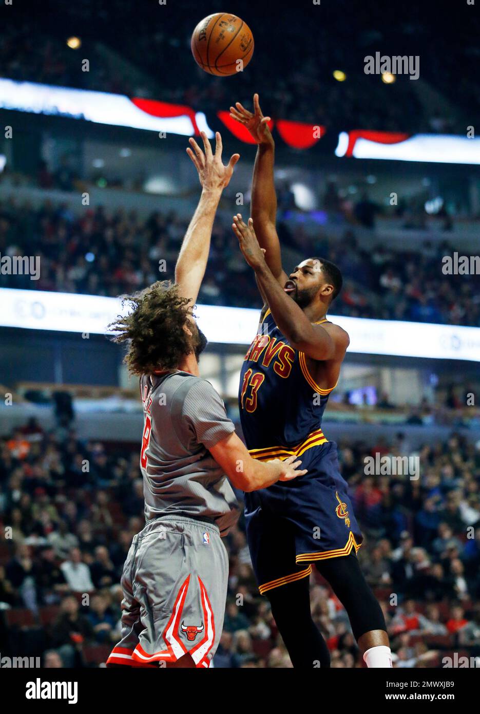 Cleveland Cavaliers forward Tristan Thompson, right, shoots over ...